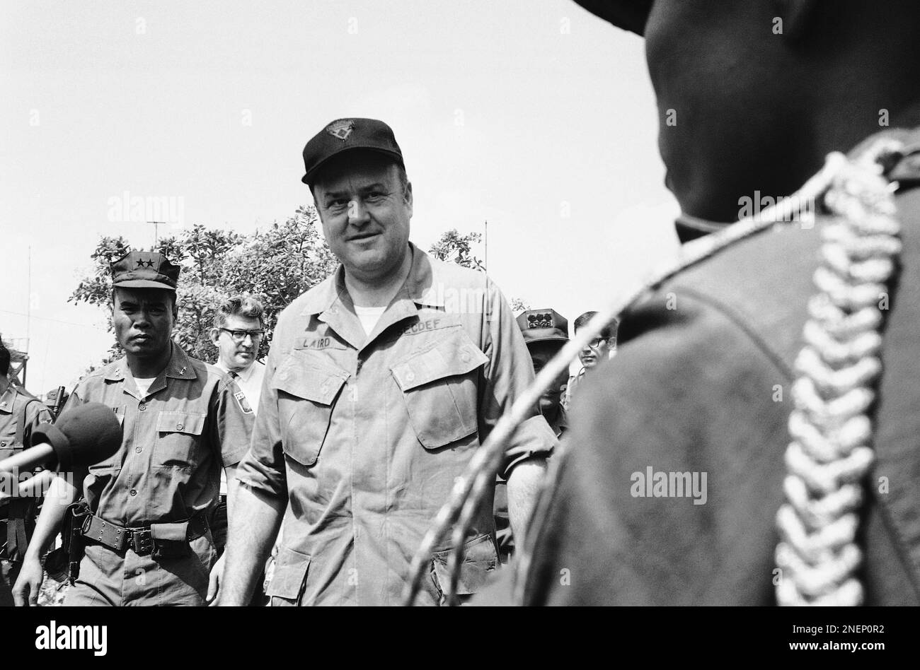 Secretary of Defense Melvin Laird walking up the path to the entrance ...
