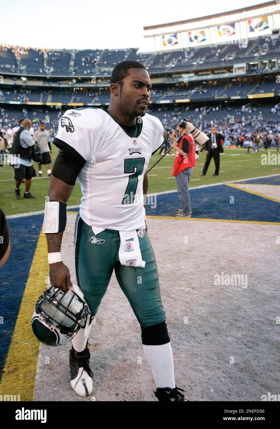 Philadelphia Eagles quarterback Michael Vick walks off the field after ...