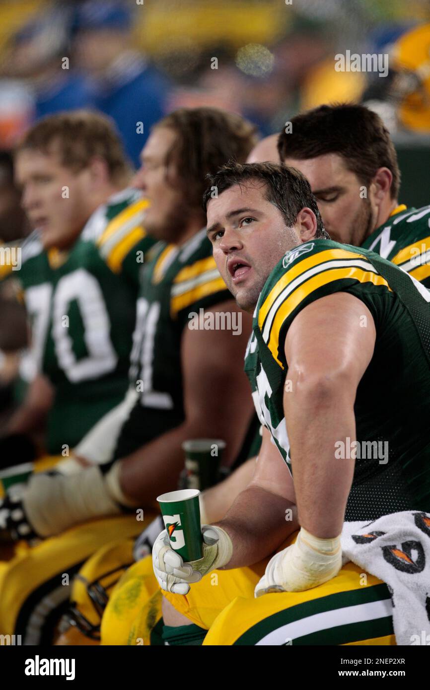 Green Bay Packers' Chad Clifton, right, is seen on the bench during the ...
