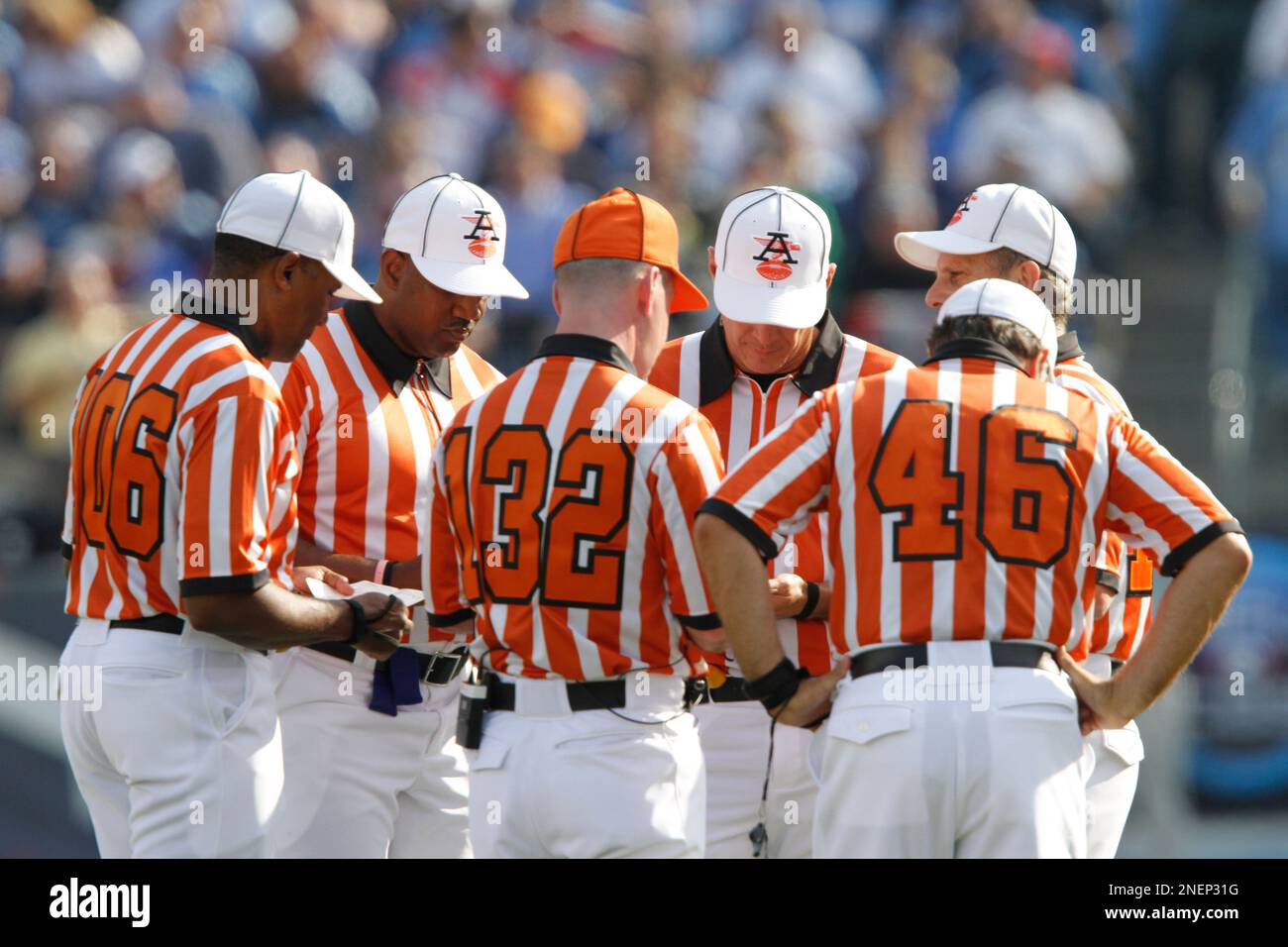 NFL officials, including Wayne Mackie (106), John Parry (132), and ...