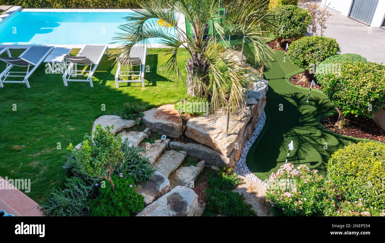 Installation of natural grass and golf course around the front yard ...