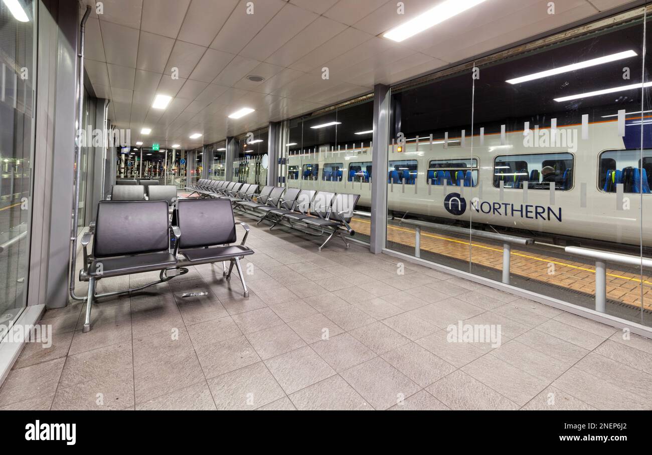 Empty waiting room with a Northern Rail train at York railway station ...