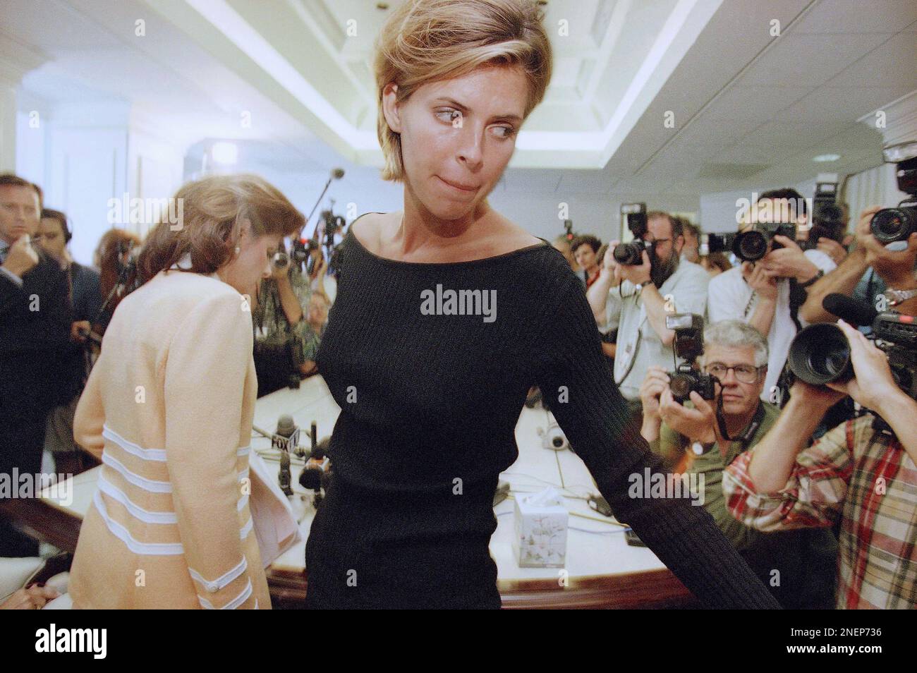 Model Kelly Fisher leaves a press conference after announcing a lawsuit ...