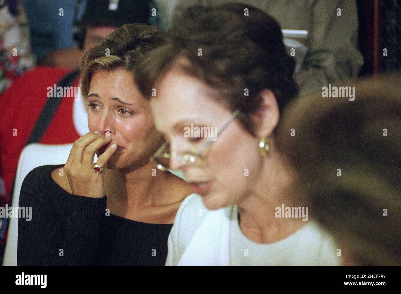 Model Kelly Fisher cries as her mother, Judith Dunaway, reads a ...