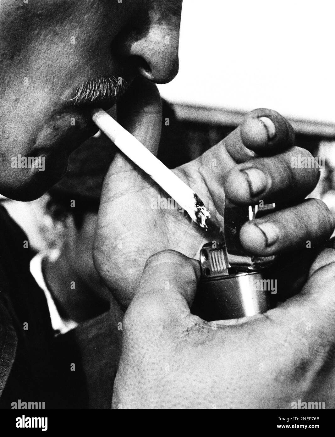 A GI lights up cigarette in Saigon, Aug. 9, 1971. He poured in grains ...
