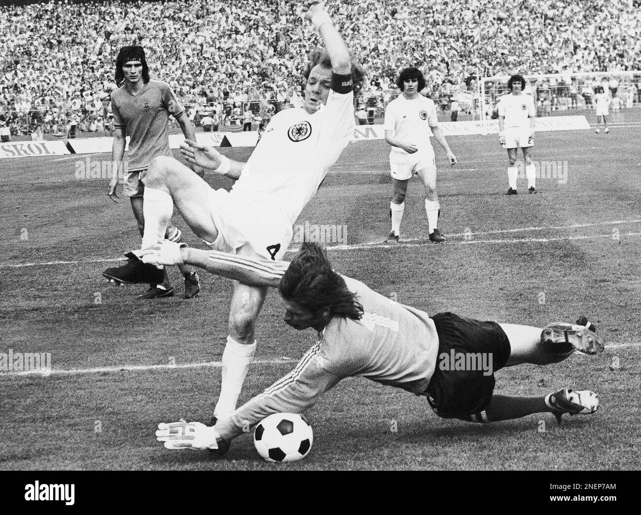 Scottish team captain Billy Bremner, centre arm raised, is stopped by ...