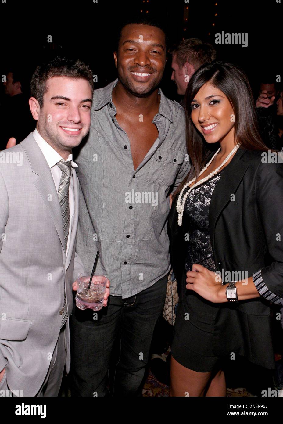 Roger Cross, center, and guests attend the Maxim and Ubisoft Assassin's ...