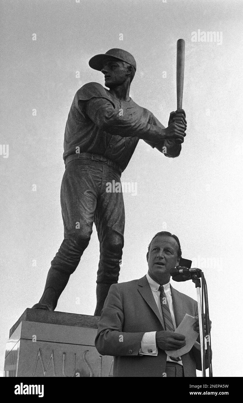 Stan Musial, the former great of the St. Louis Cardinals wipes away a ...