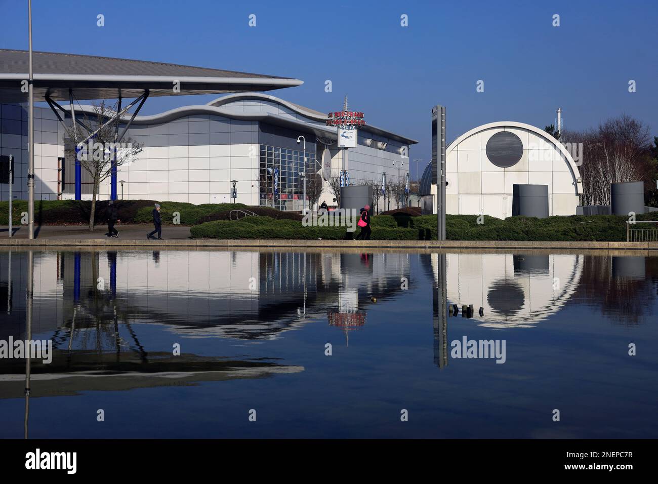 Abstract reflections in a water feature, Red Dragon Centre, Cardiff Bay ...
