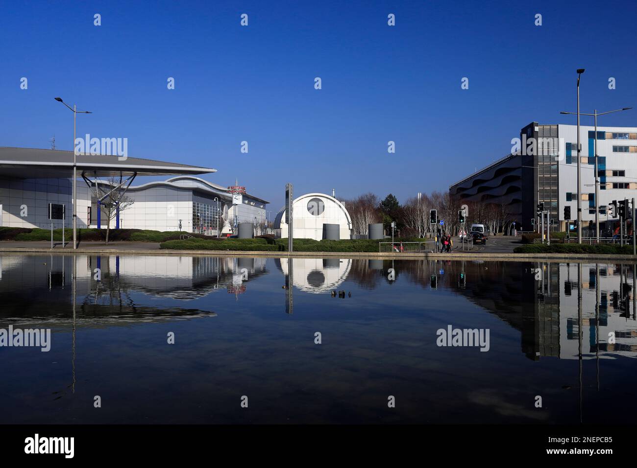 Abstract reflections in a water feature, Red Dragon Centre, Cardiff Bay ...