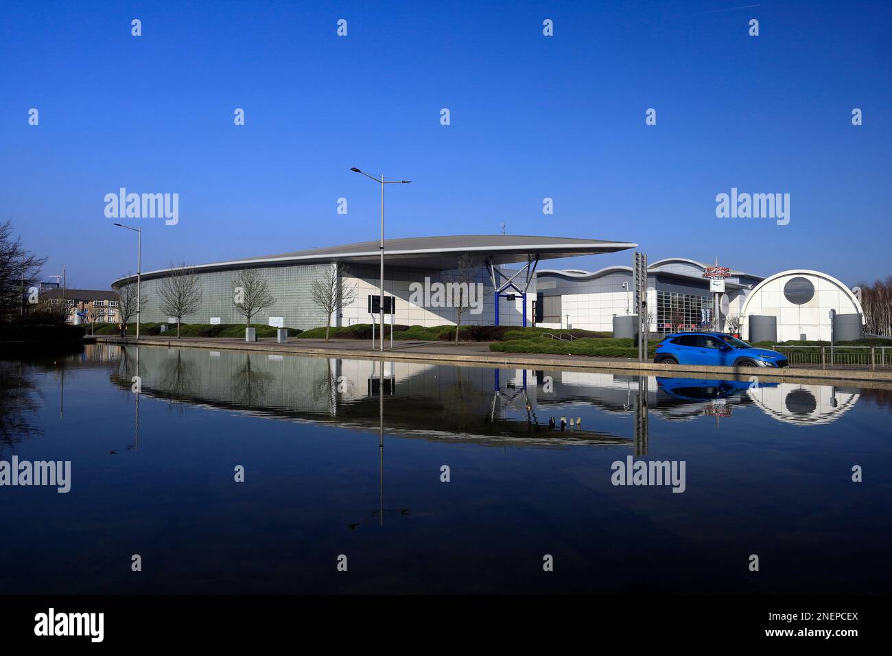 Abstract reflections in a water feature, Red Dragon Centre, Cardiff Bay ...