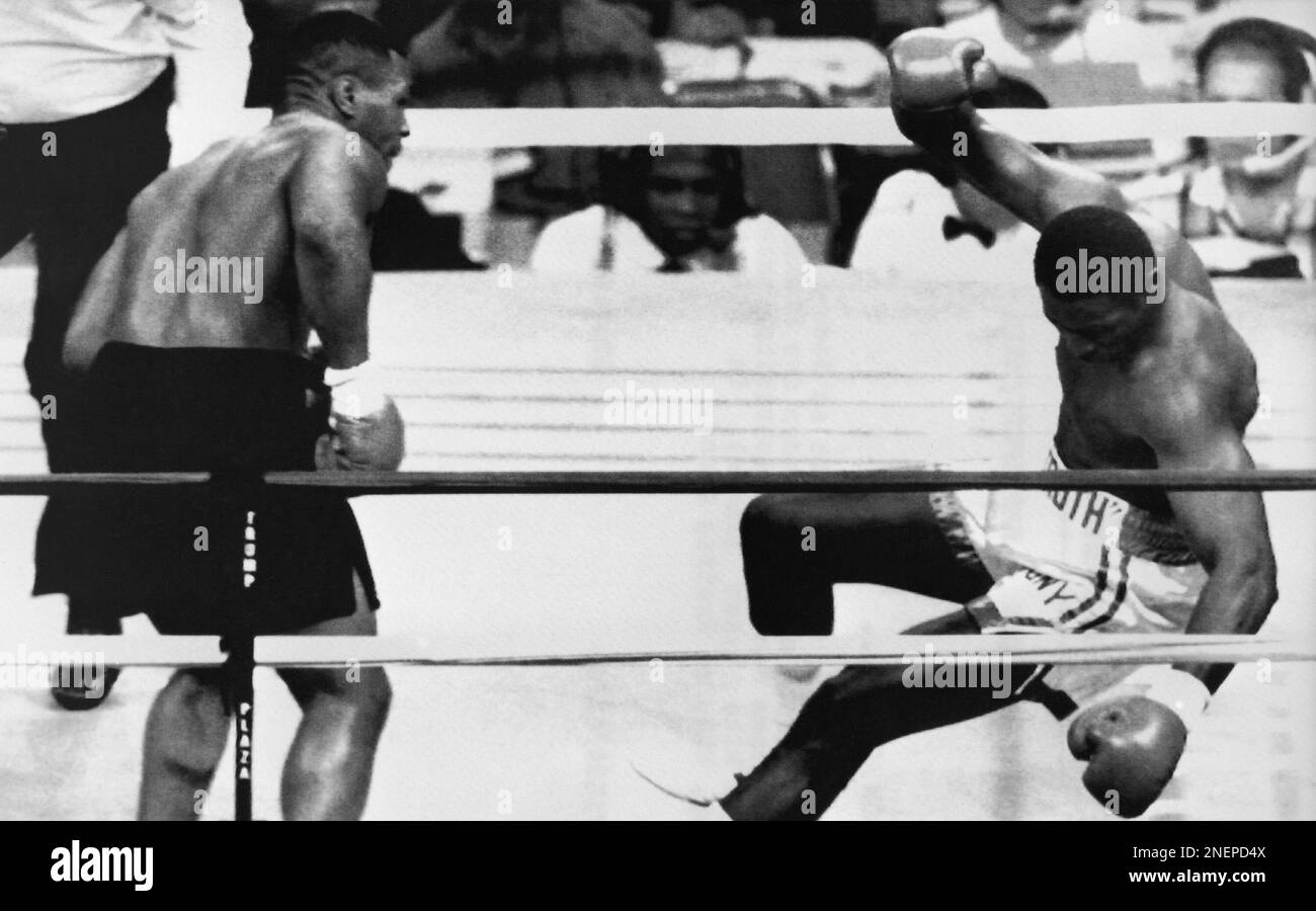 American boxer Carl Williams, right, goes down in the first round in ...