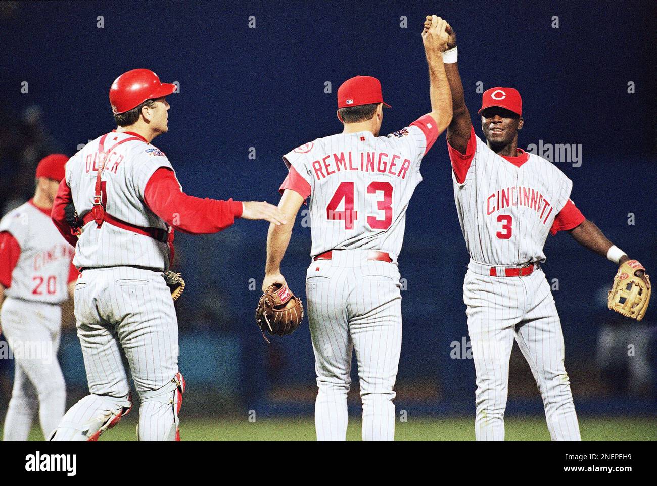 Cincinnati Reds shortstop Pokey Reese, right, gives a high-five to ...