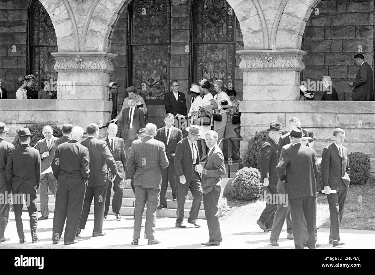 Rev. Earl Stallings, pastor of the First Baptist Church, shakes hands ...