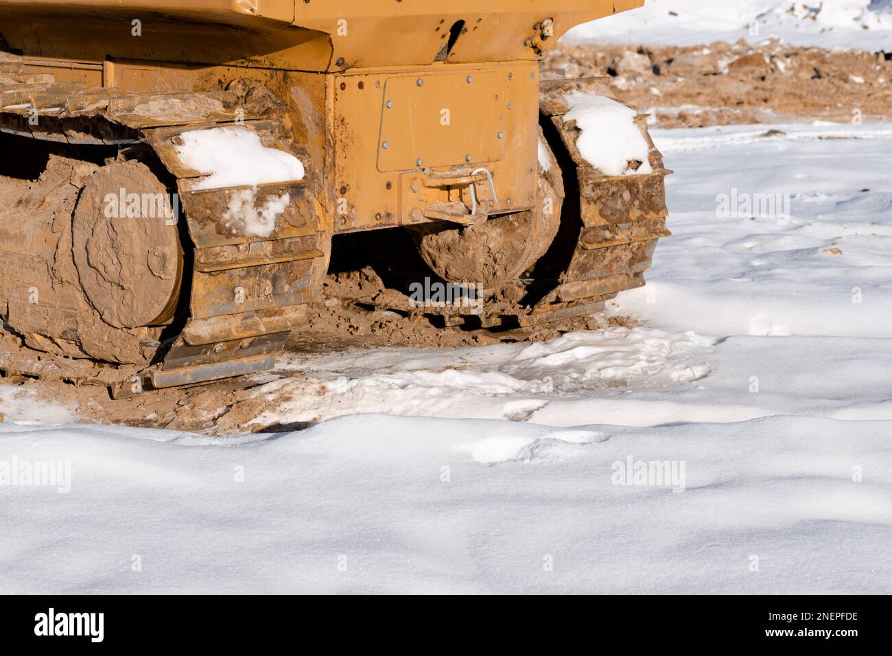 Bulldozer tracks close-up in winter. Construction industry concept ...
