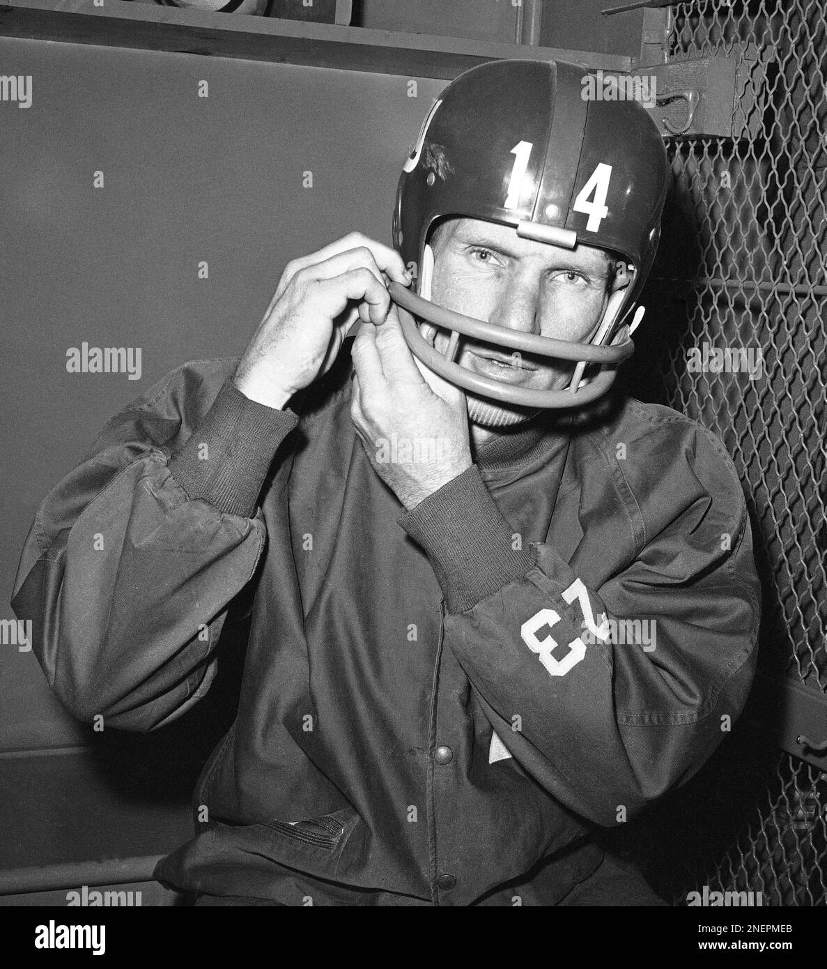 New York Giant quarterback, Y.A. Tittle, poses in locker room at Yankee ...