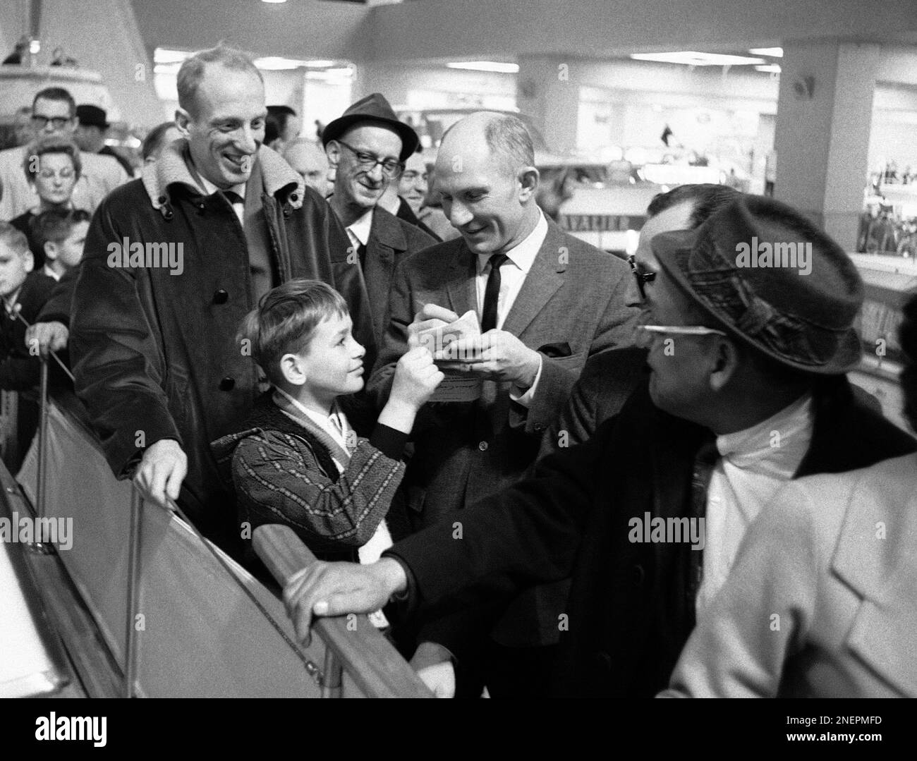Quarterback Y.A. Tittle of the New York Giants gives his autograph to a ...
