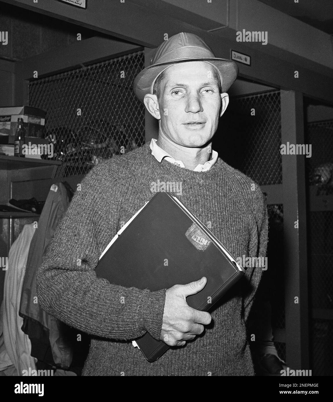 New York Giant quarterbacks Y.A. Tittle, poses in locker room at New ...