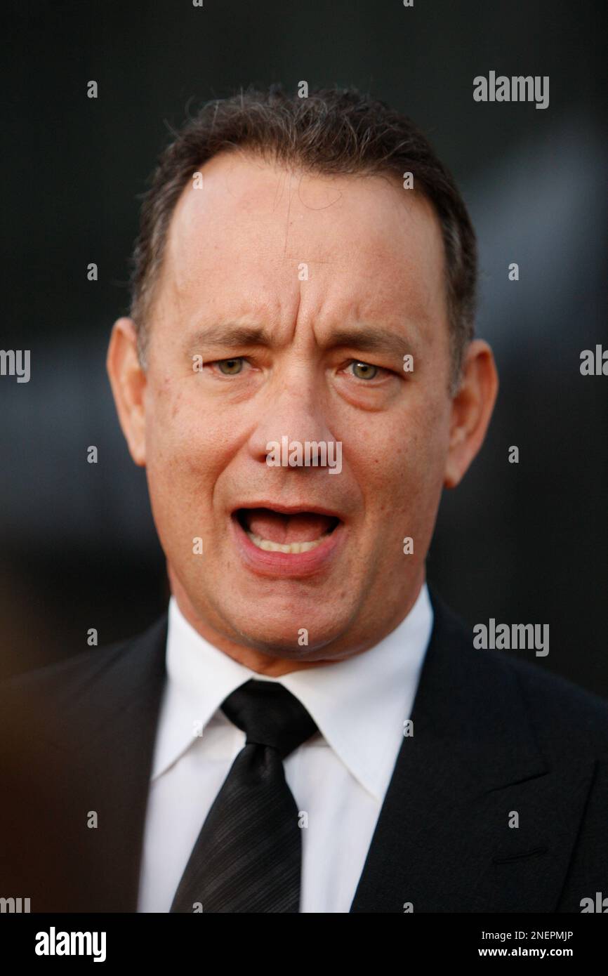 Actor Tom Hanks conducts an interview as he arrives at the World War II ...