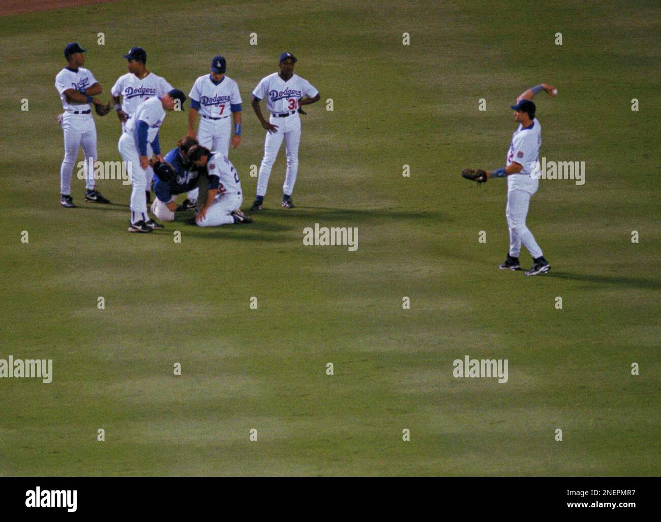 Los Angeles Dodgers? Brett Butler is attended by Dodgers trainer ...