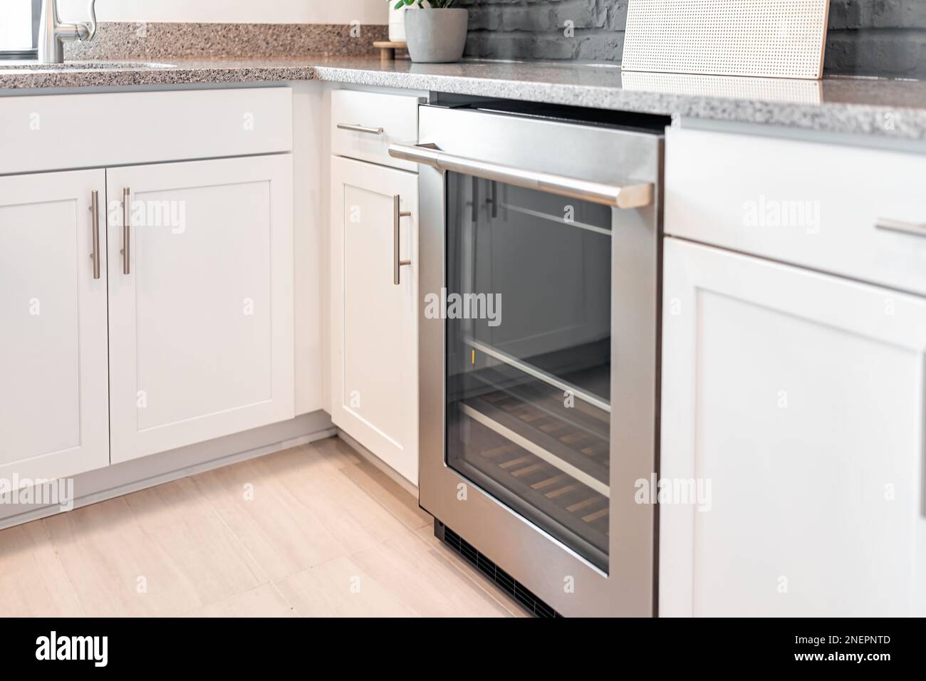 Modern white kitchen cabinets and mini bar appliance by granite ...