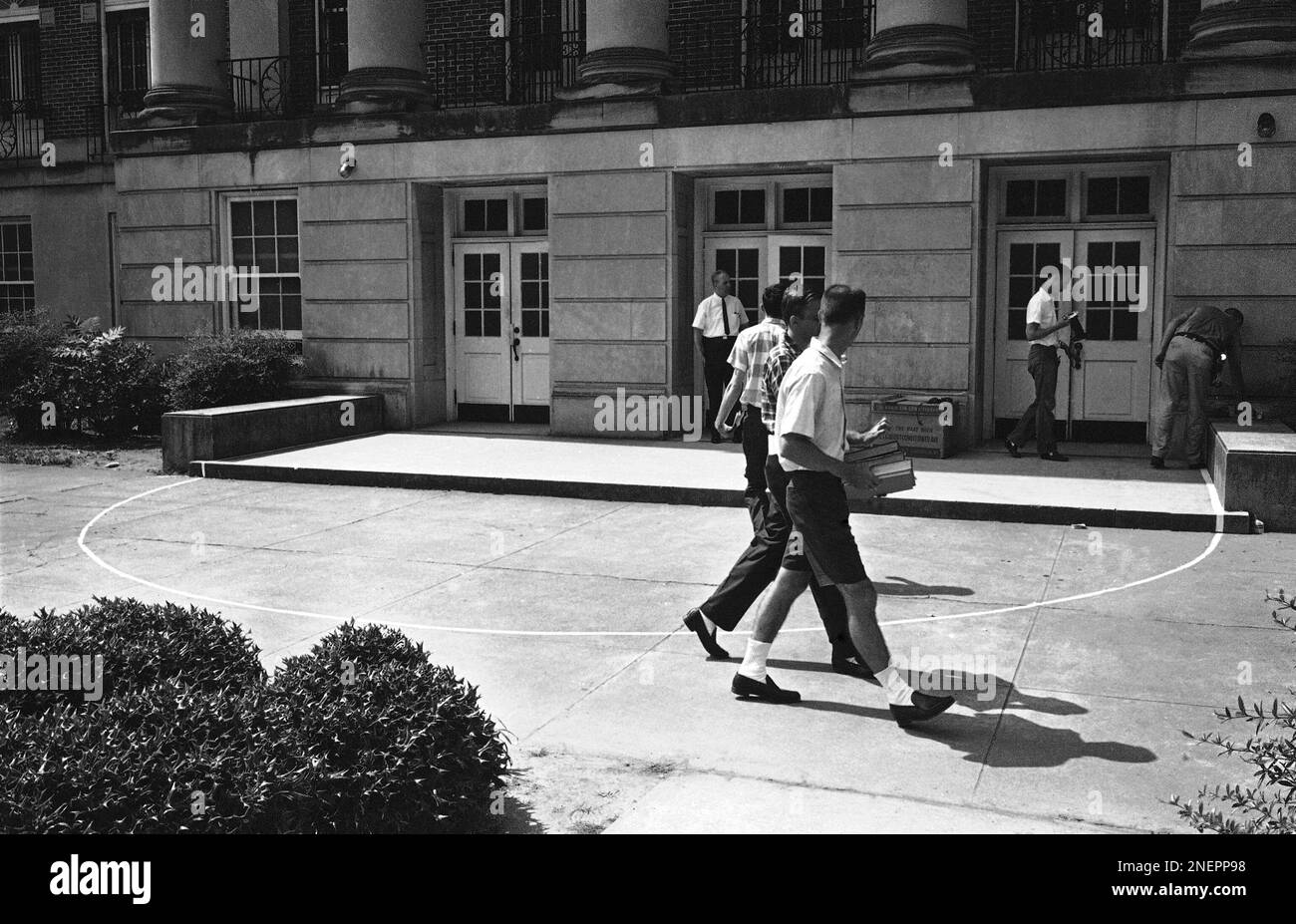 Students stroll by the front of Foster auditorium on the campus of the ...