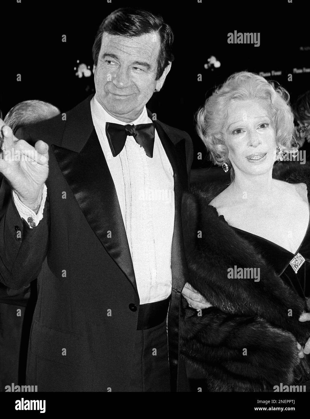 Actor Walter Matthau gestures, accompanied by his wife Carol, as they ...