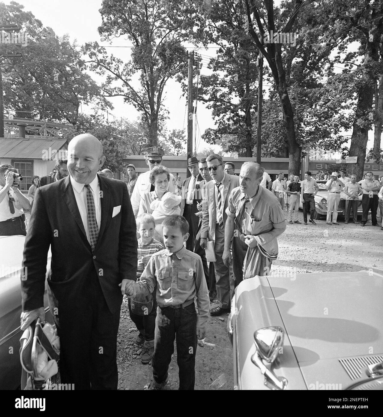 James Coleman, a professor at Johns Hopkins University holding his son ...