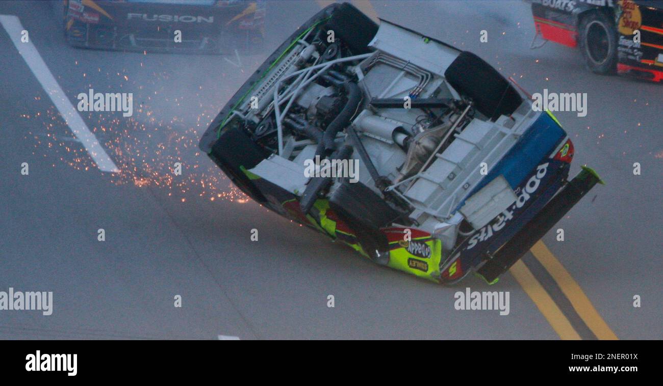 NASCAR driver Mark Martin (5) flips on the tri-oval after being struck ...