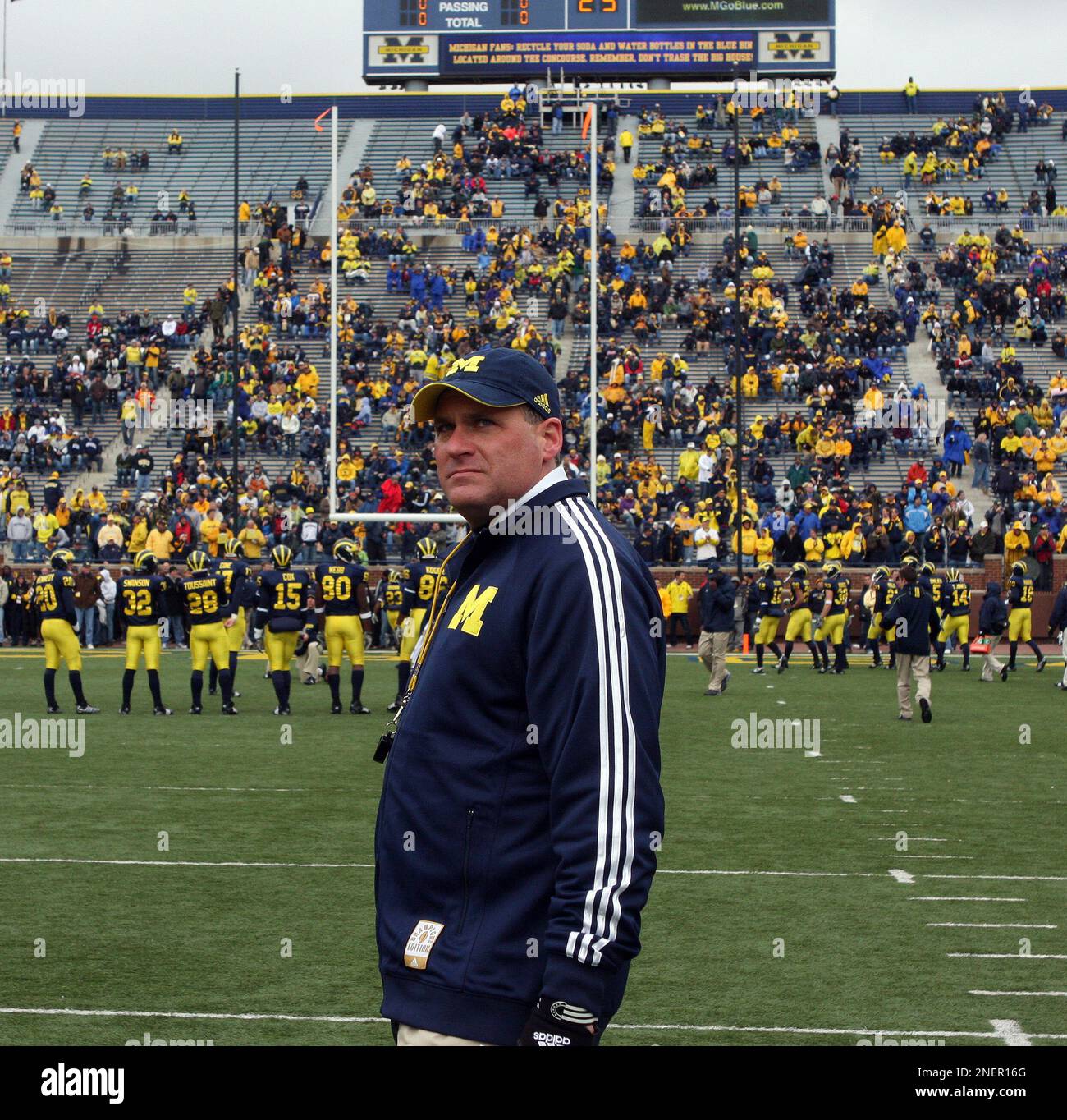 Michigan head coach Rich Rodriguez walks the Michigan Stadium turf ...