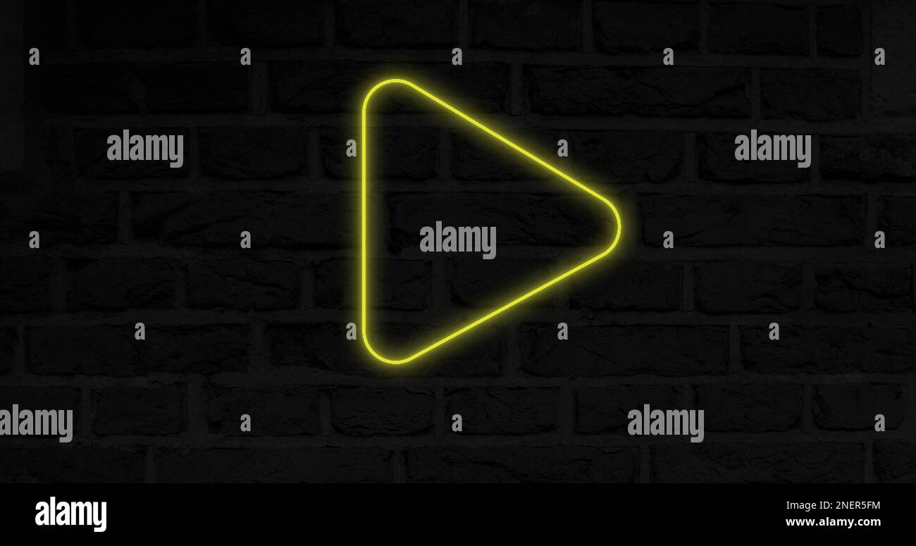 Animation of play neon icon flickering over brick wall Stock Photo - Alamy