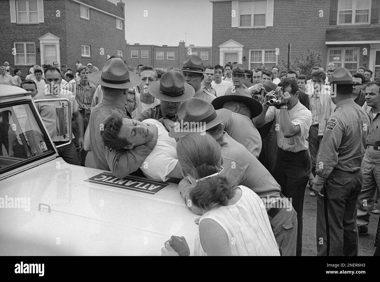 Pennsylvania State police troopers subdue a demonstrator at Folcroft, Pennsylvania on August 30 ...