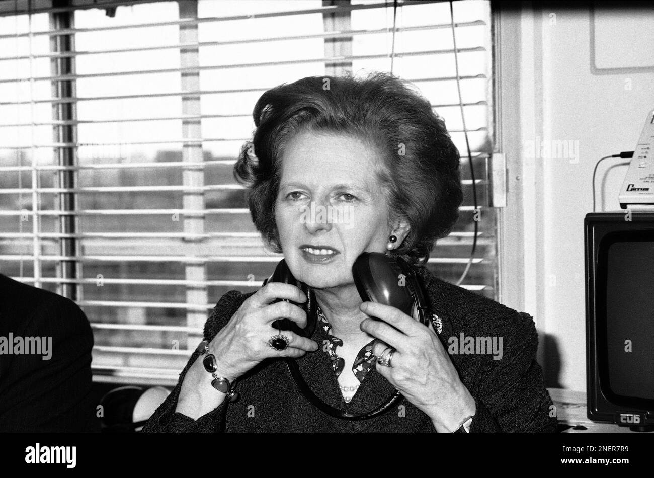 Britain's Prime Minister Margaret Thatcher removes headphones during ...