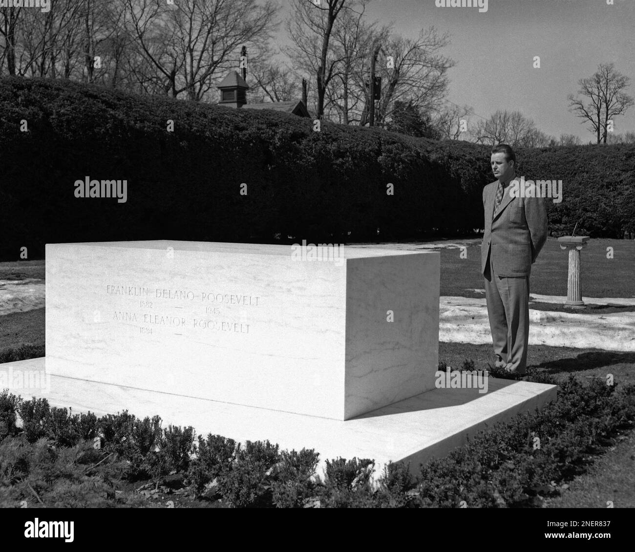 Elliott Roosevelt stands by the marble stone marking the grave of his ...