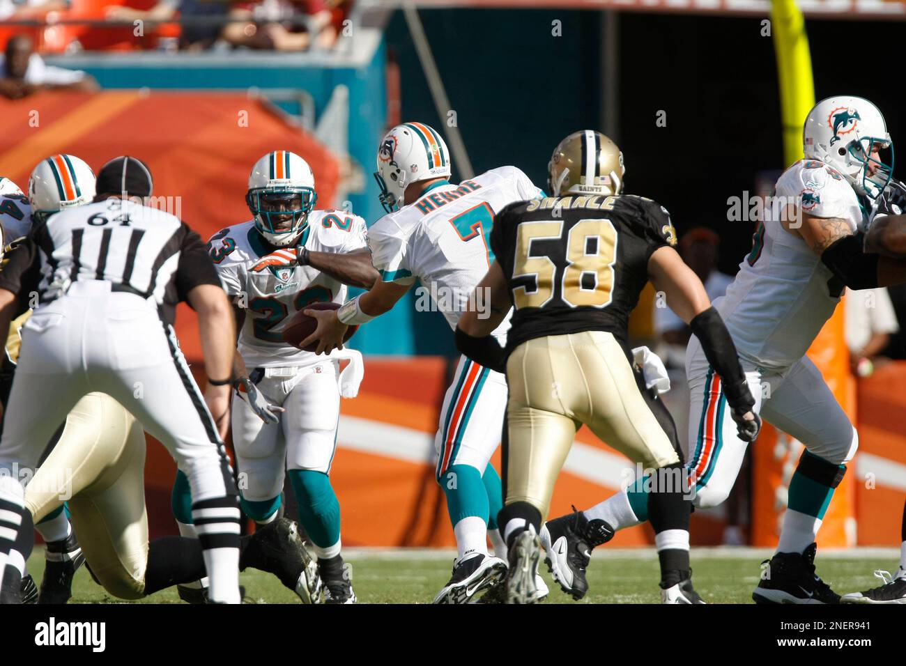 Miami Dolphins quarterback Chad Henne (7) hands the ball off to Ronnie ...