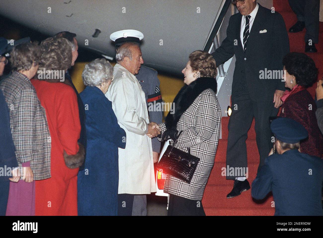 British Prime Minister Margaret Thatcher, right, is greeted by ...