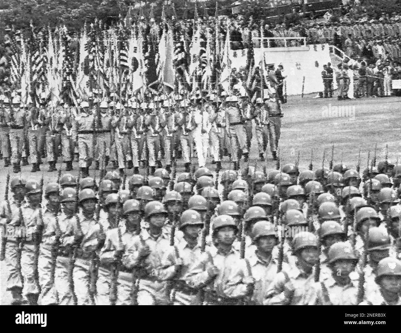 Troops of various nations parade in review for President Dwight ...