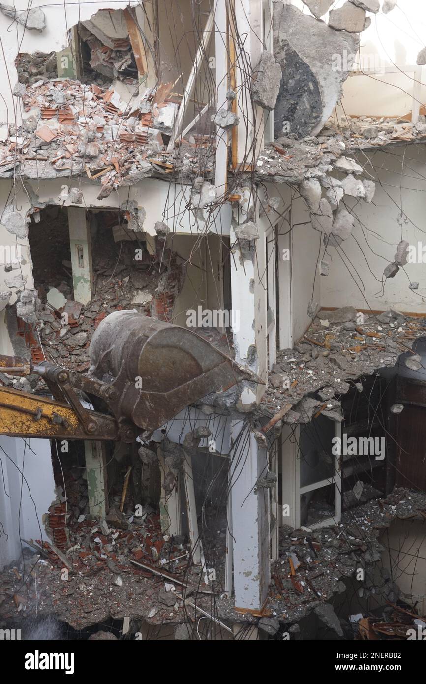Excavator in demolition building debris hi-res stock photography and ...