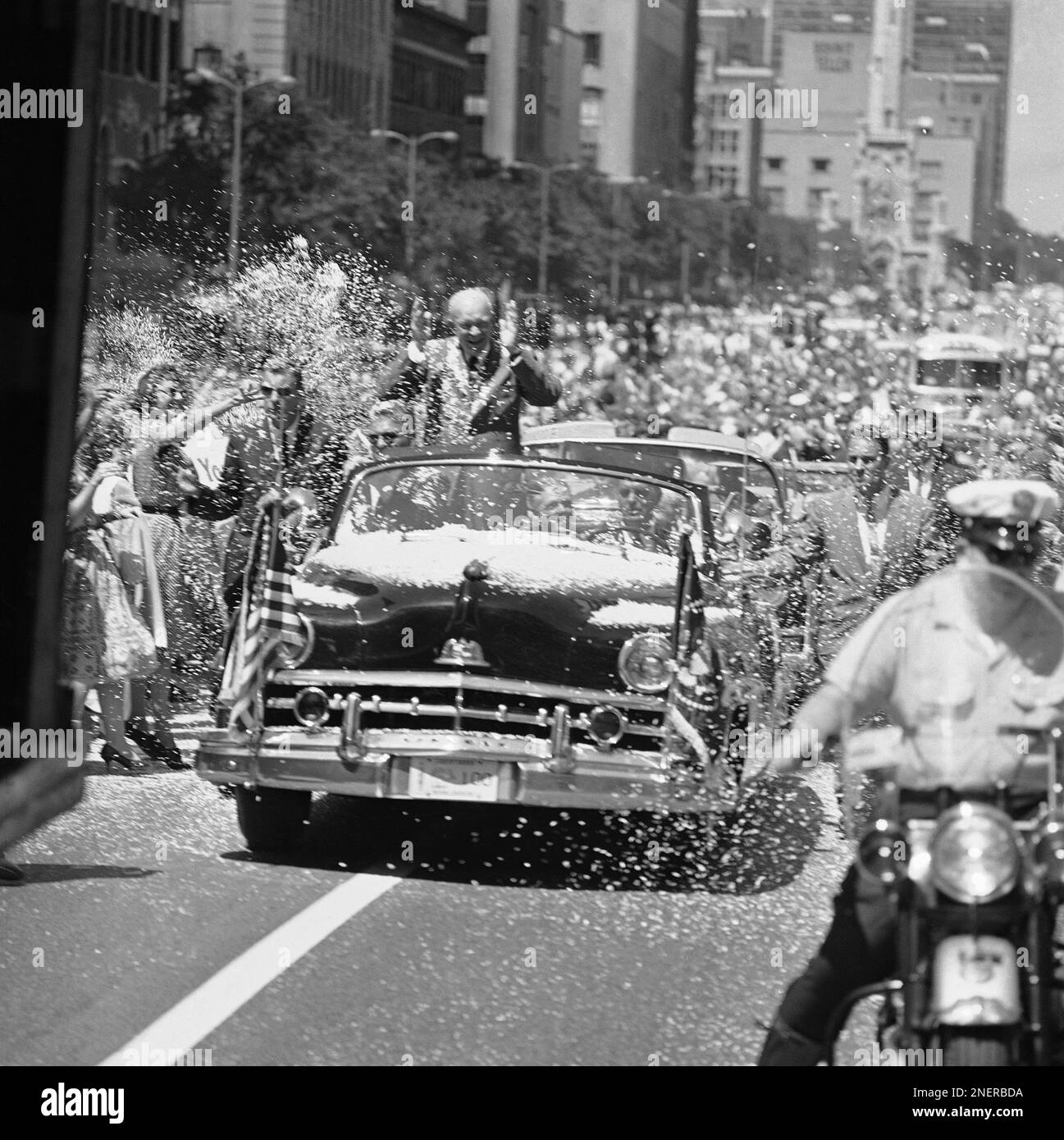 Air is filled with confetti as huge crowd welcomes President Dwight ...