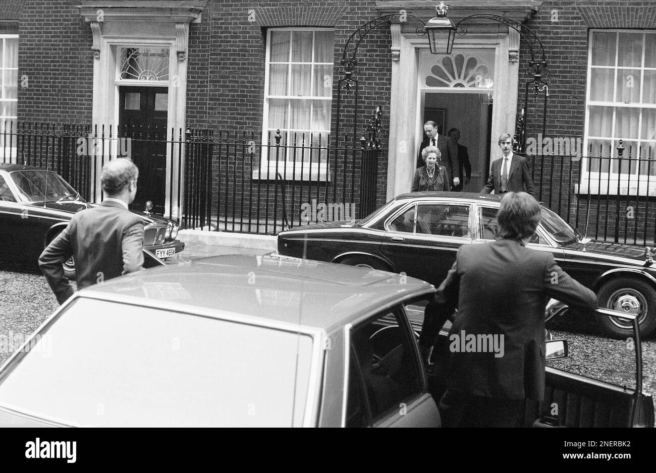 Police officers watch from beside their car as Britain?s Prime Minister ...