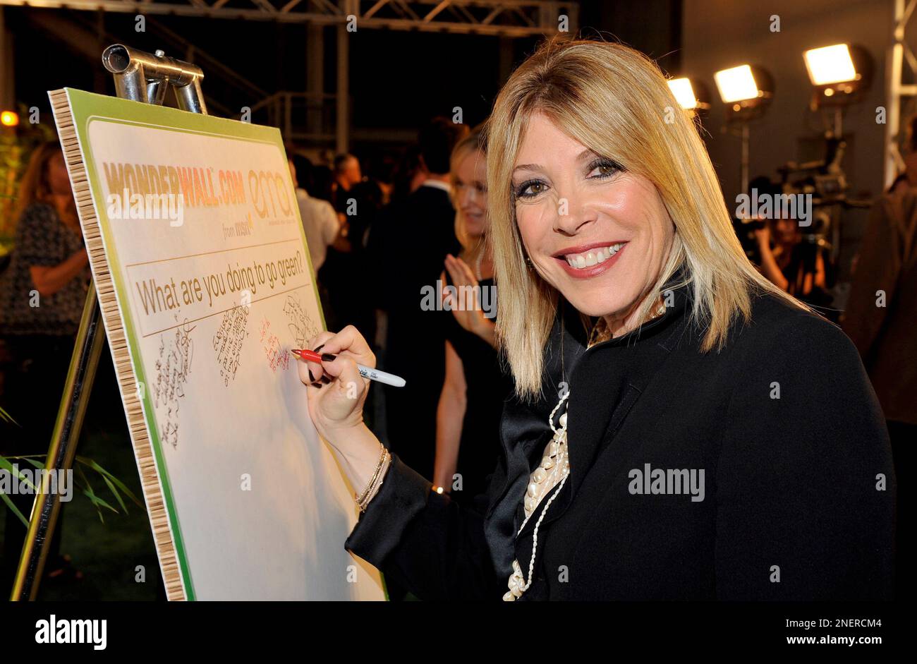 EMA President, Debbie Levin signs the wonderwall.com poster at the 20th ...