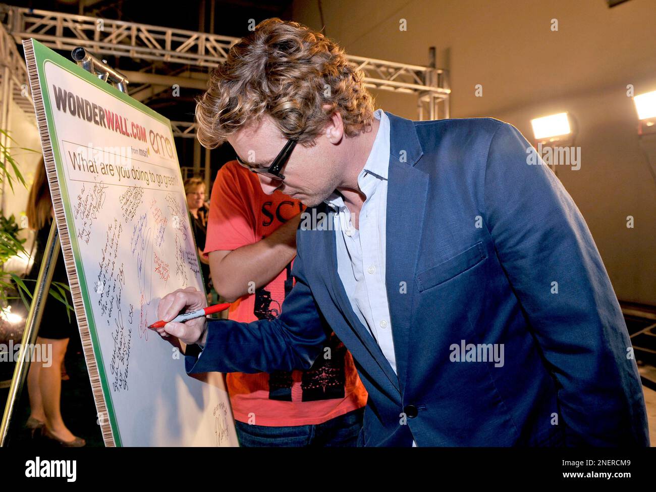 Actor Simon Baker signs the wonderwall.com poster at the 20th ...