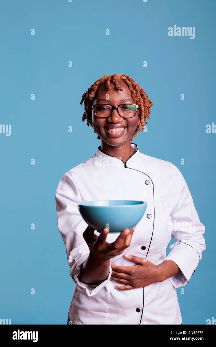 African american woman happily smiling, professional chef uniformed ...
