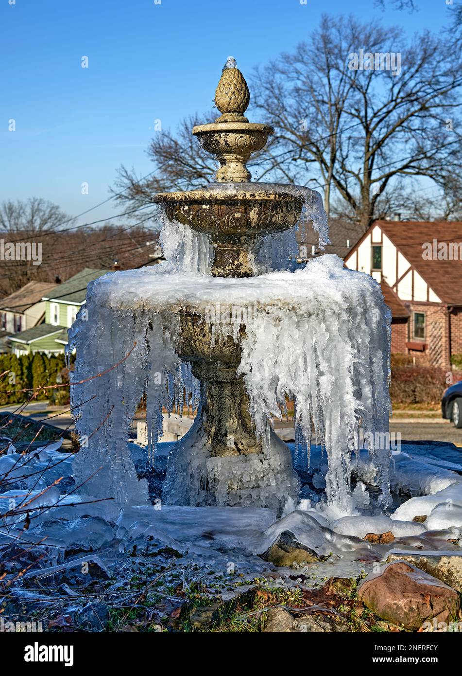 A large Fountain covered in ice. With a clear blue sky background Stock ...