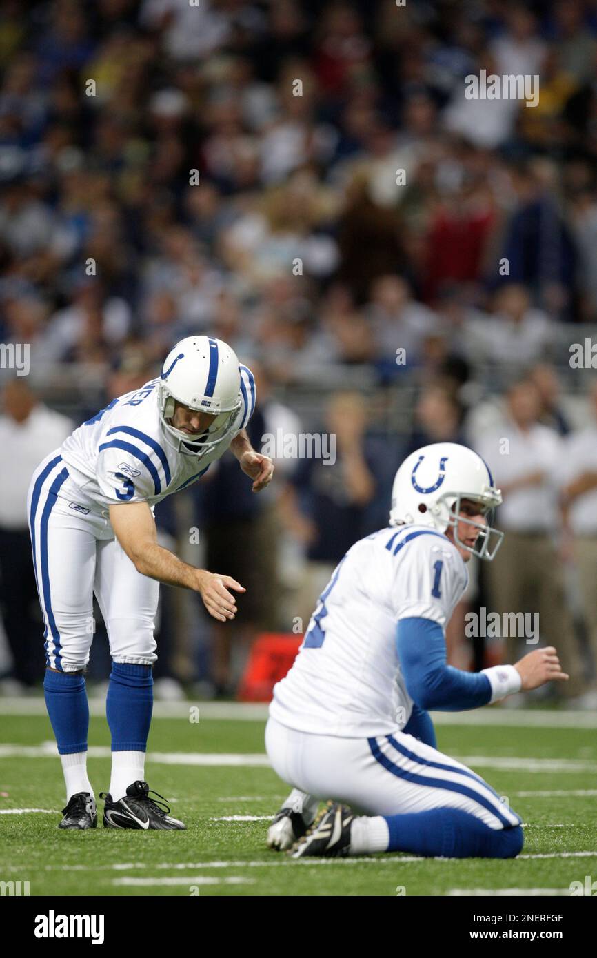 Indianapolis Colts kicker Matt Stover, left, prepares to kick an extra ...