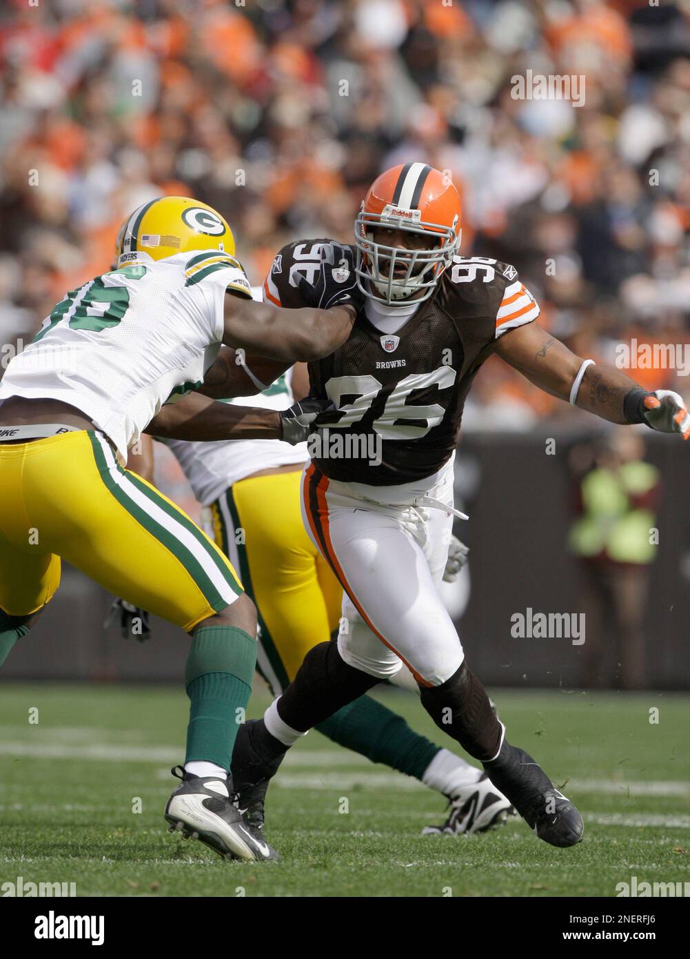 Cleveland Browns linebacker David Bowens (96) works to get around Green ...