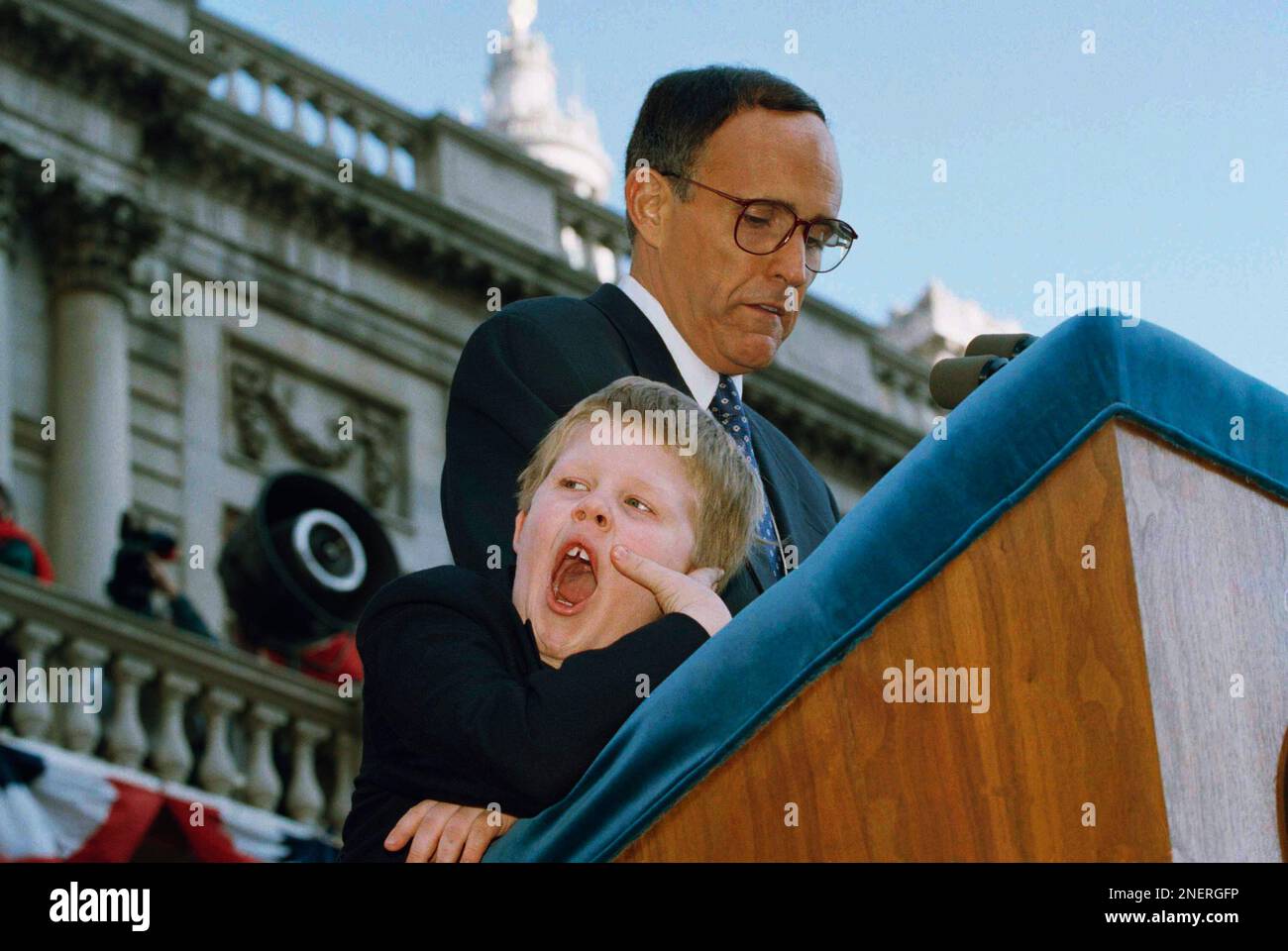 Andrew Giuliani, left, yawns as his father, New York Mayor Rudolph ...