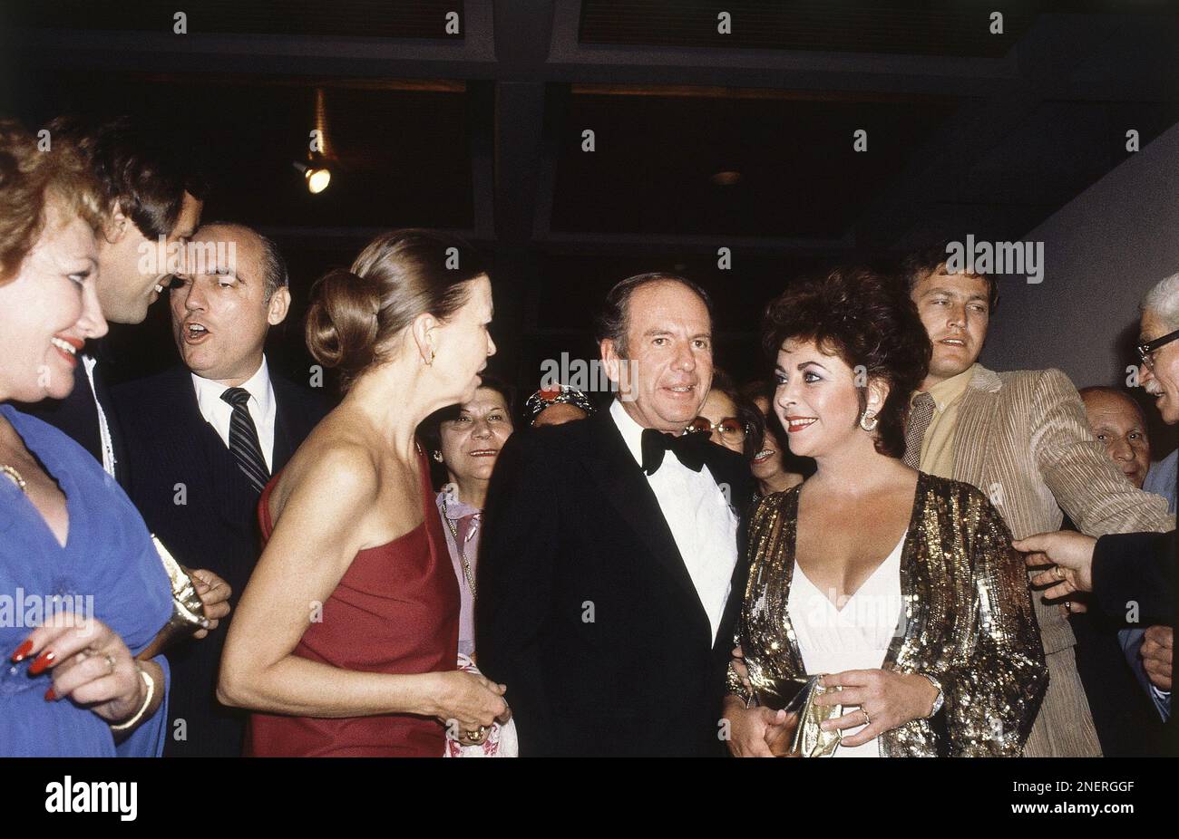 Actress Elizabeth Taylor with friend Victor Luna and unidentified ...