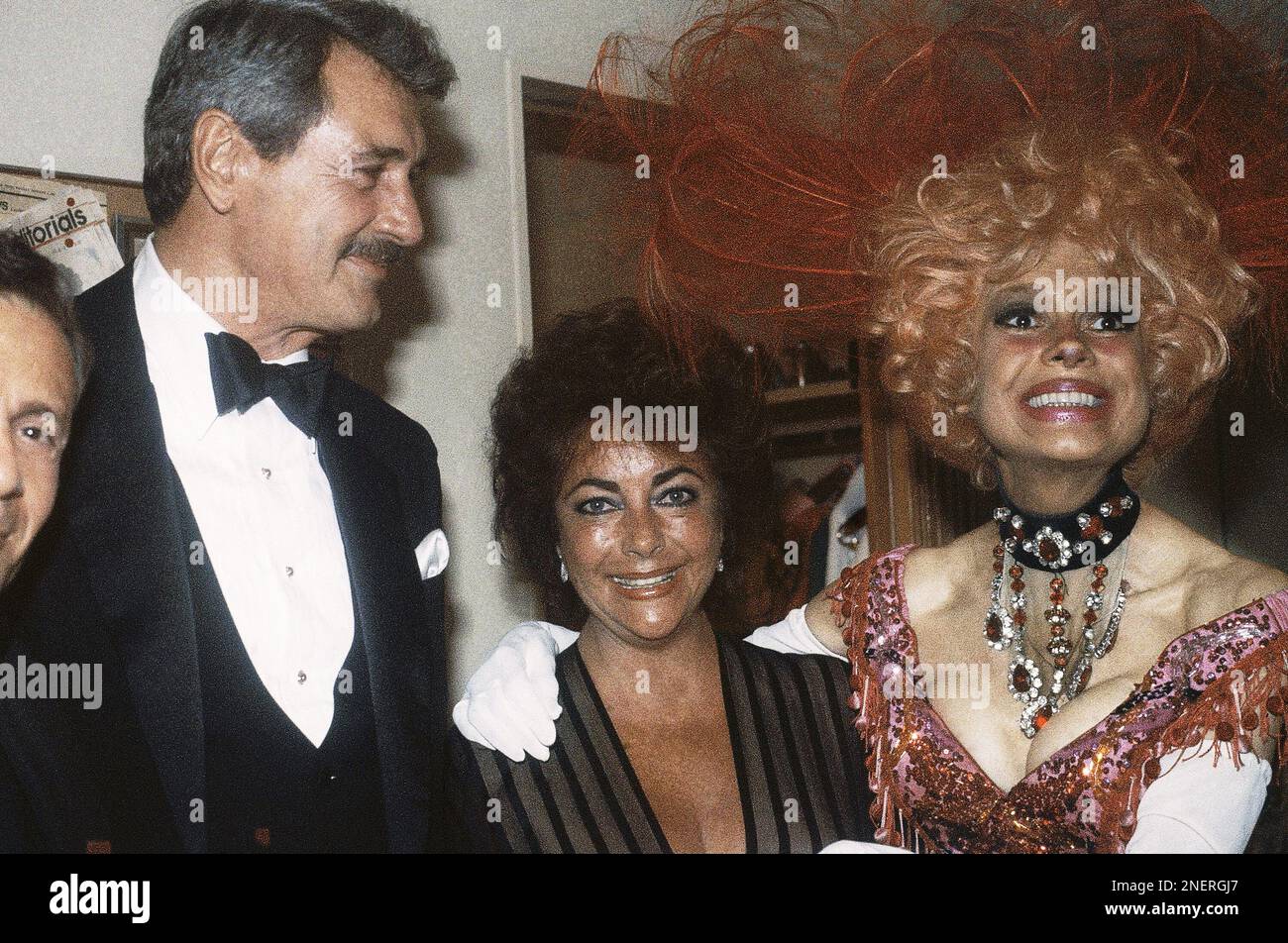 Actress Elizabeth Taylor flanked by Rock Hudson backstage visiting ...