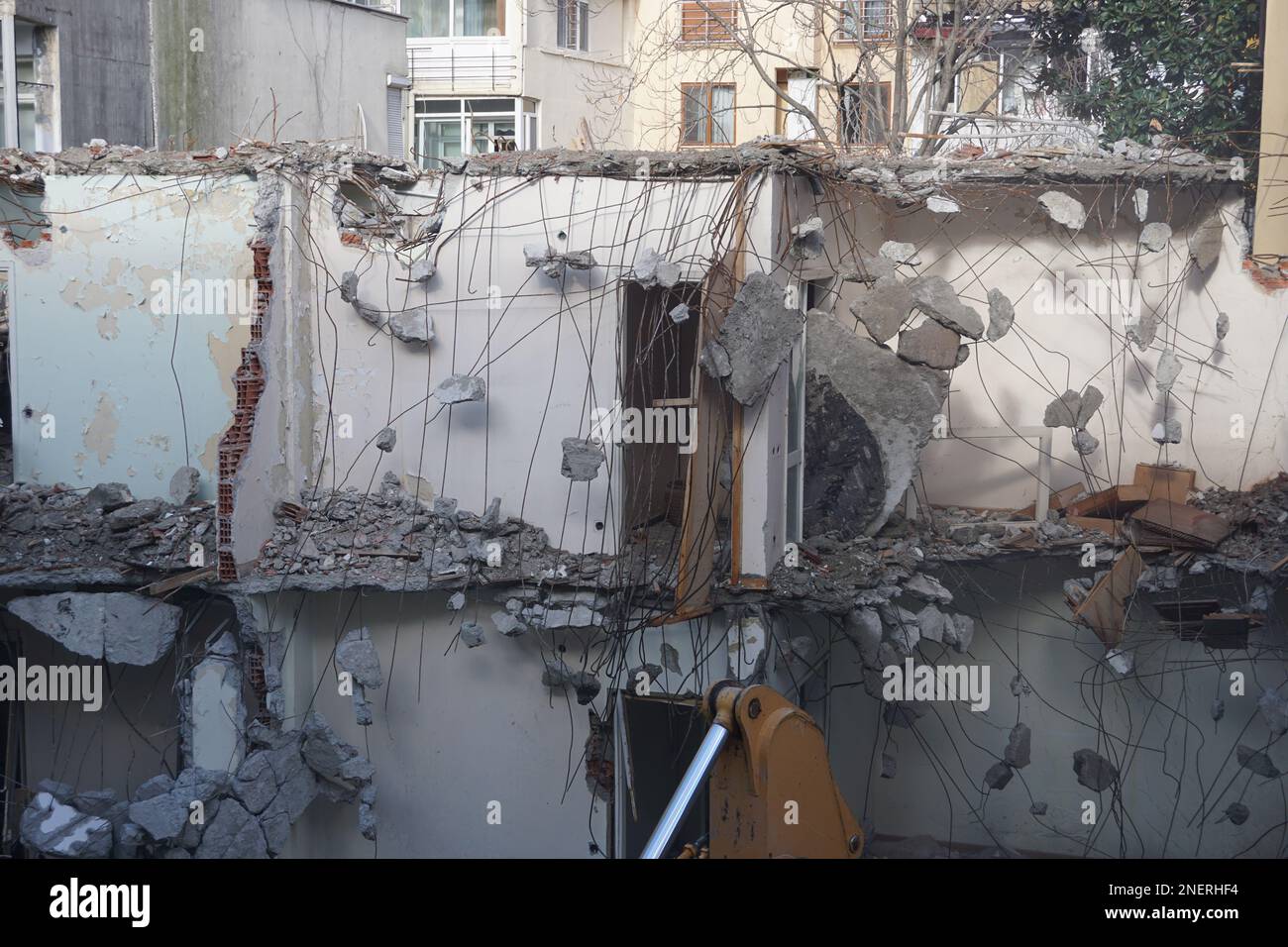Excavator in demolition building debris hi-res stock photography and ...